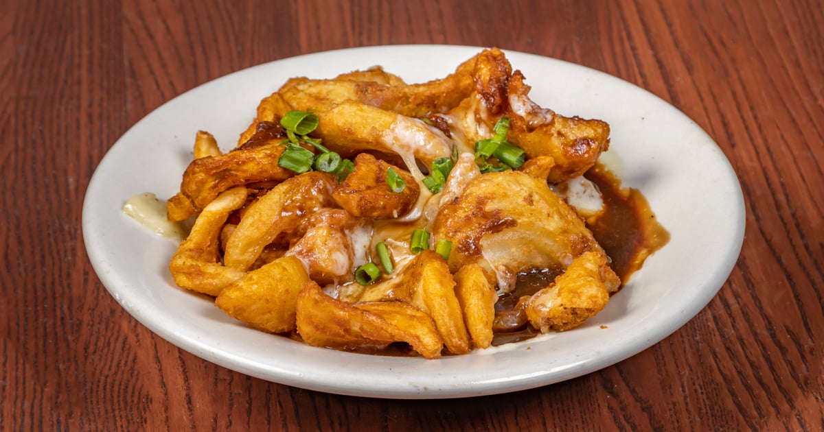 Poutine with Green Onions - The Whistling Pig Neighborhood Pub