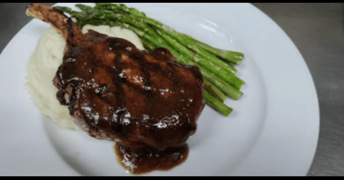 Bourbon Glazed Tomahawk Chop - Feature Menu - Nick & Tom's Restaurant ...